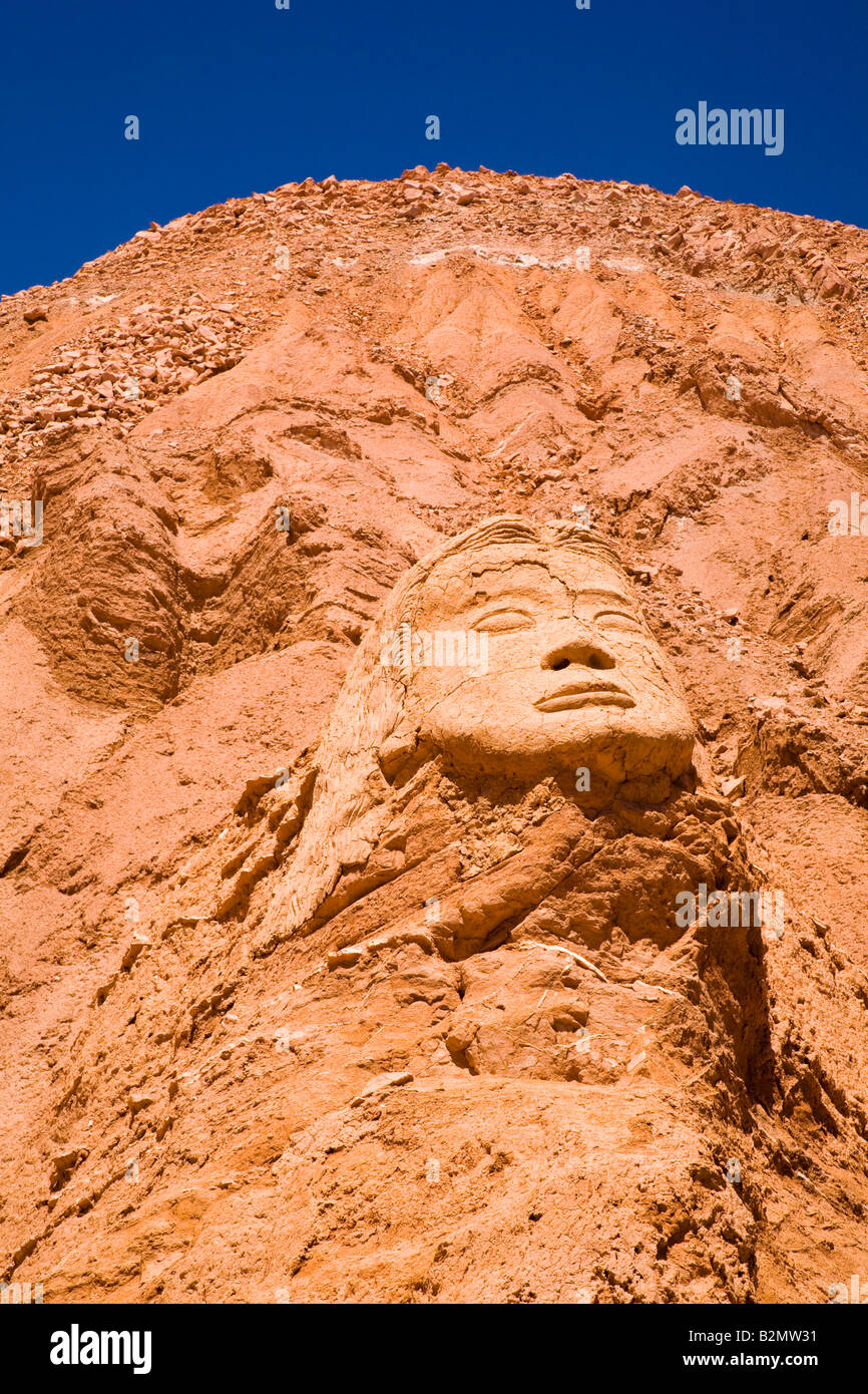 Chile Atacama Desert Plaza Quitor Carved face in the stone wall of the ...