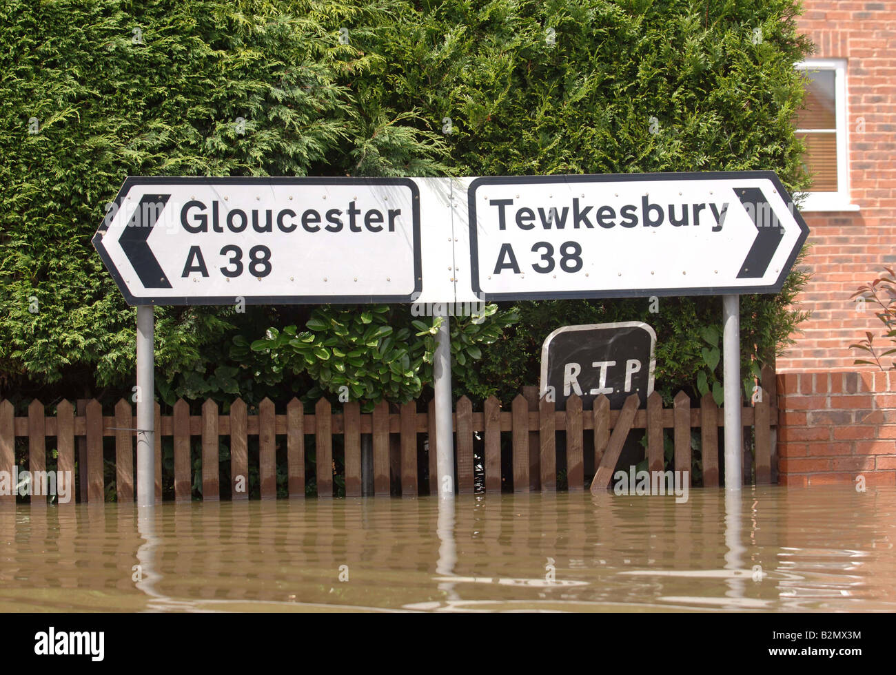 A ROADSIGN ON THE A38 ROAD IN SANDHURST POINTING THE WAY TO GLOUCESTER ...