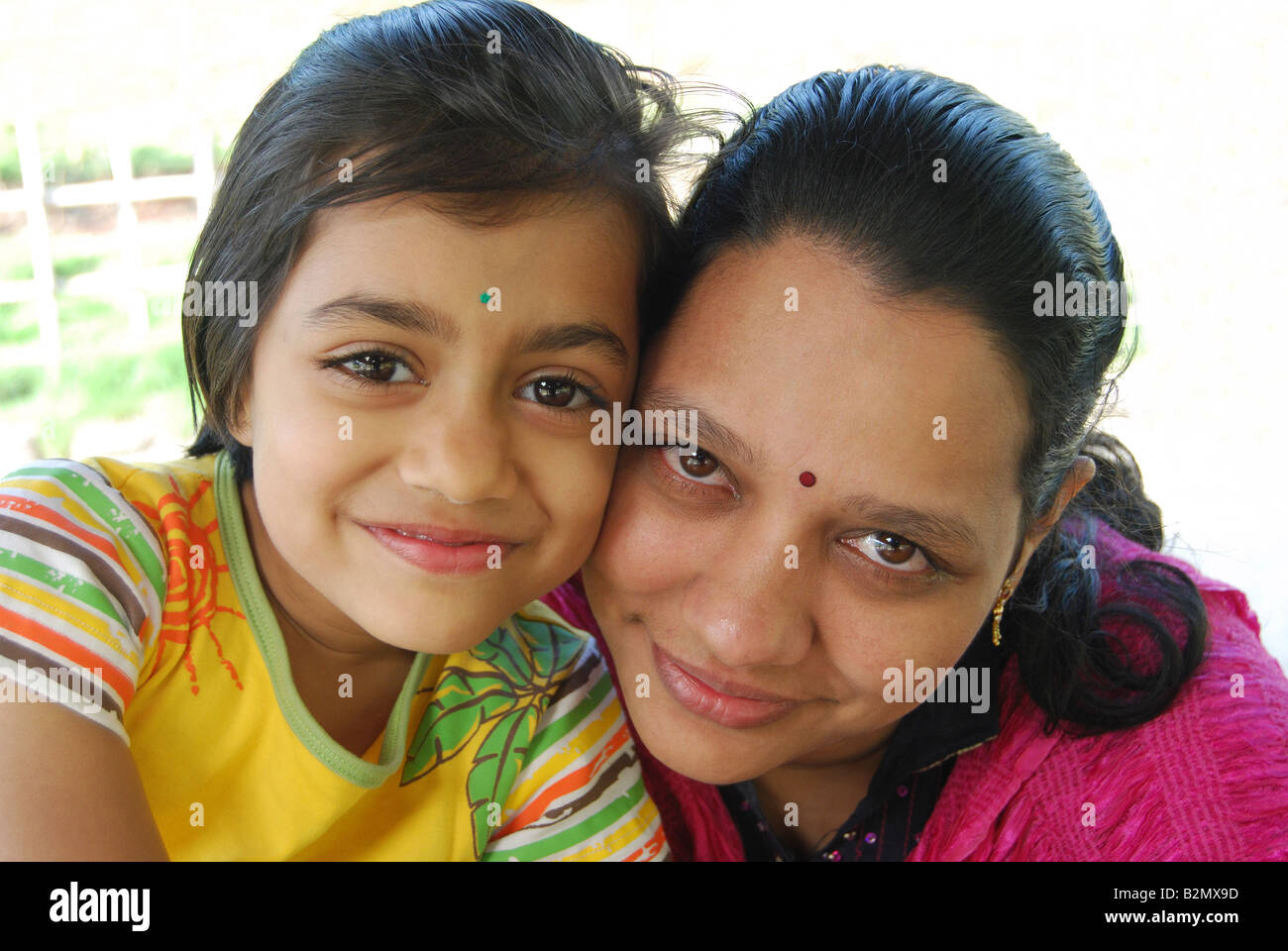 Mother hugging her child Stock Photo - Alamy