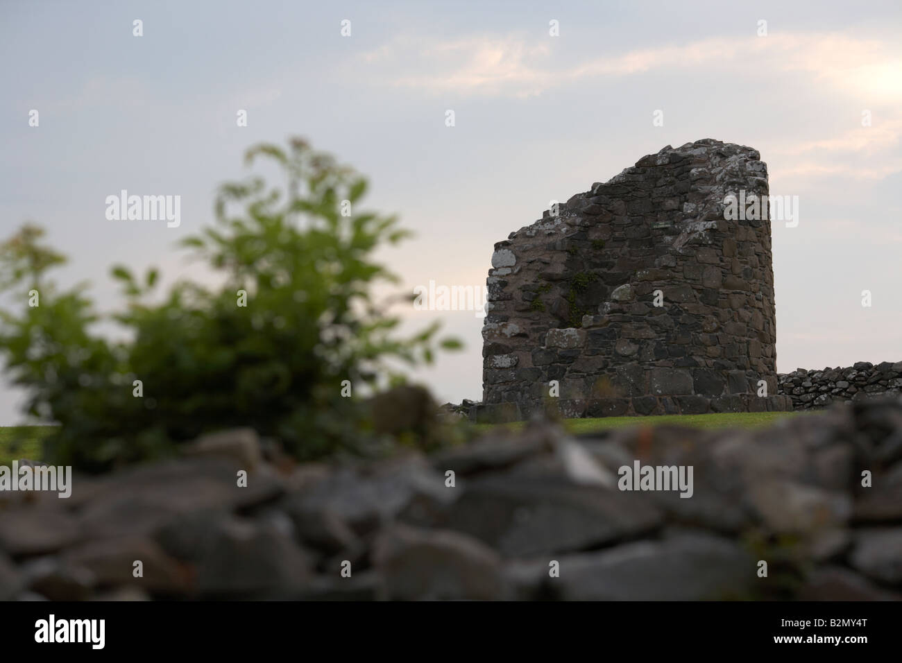 remains of old ruined walls and round tower at nendrum monastic site ...