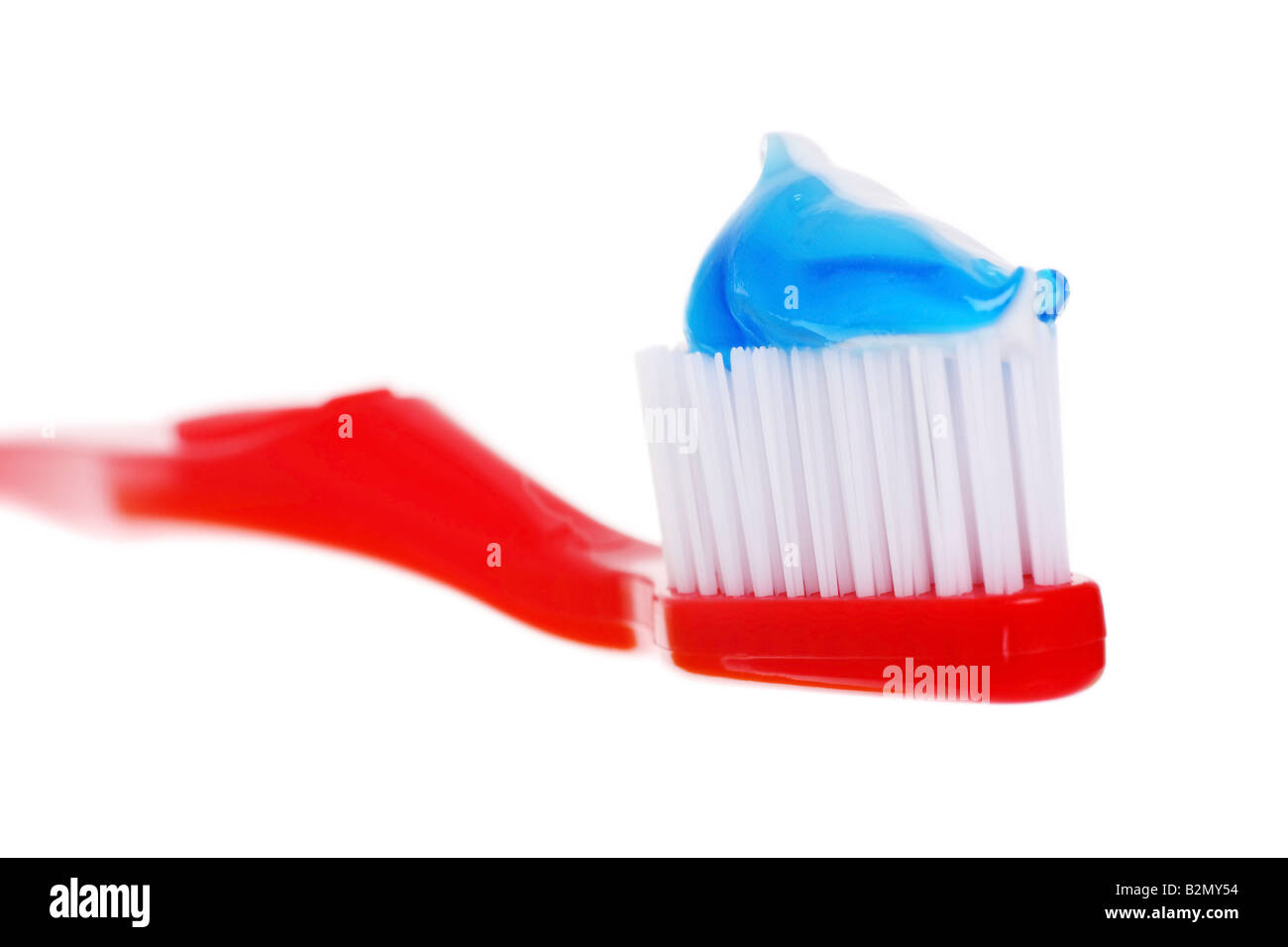 toothbrush and paste focus on toothpaste and brush head Stock Photo - Alamy