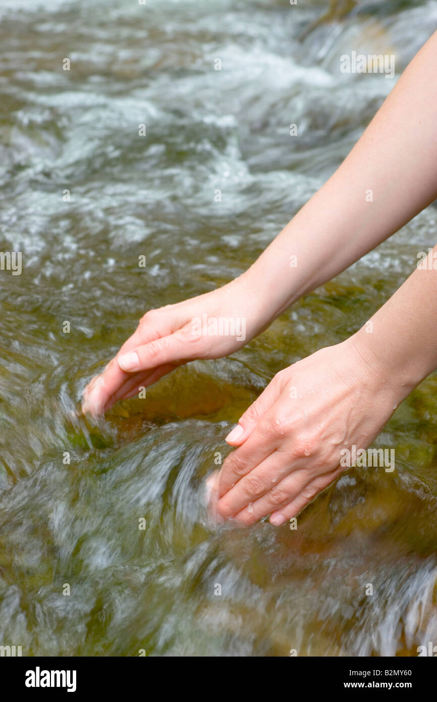 Female hands scooping water from a mountain stream Stock Photo - Alamy