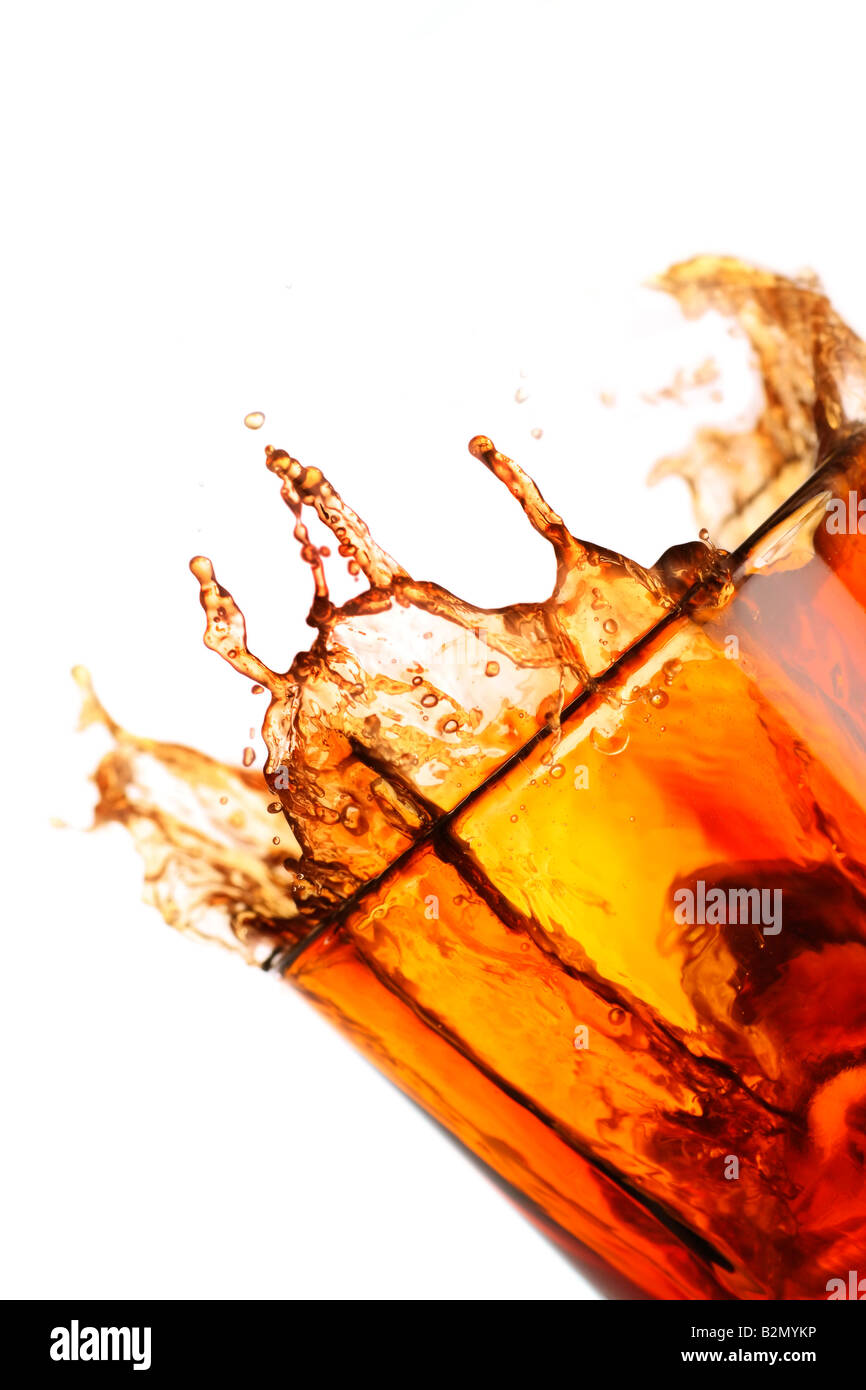 ice filled carbonated soft drink with a splash Stock Photo - Alamy