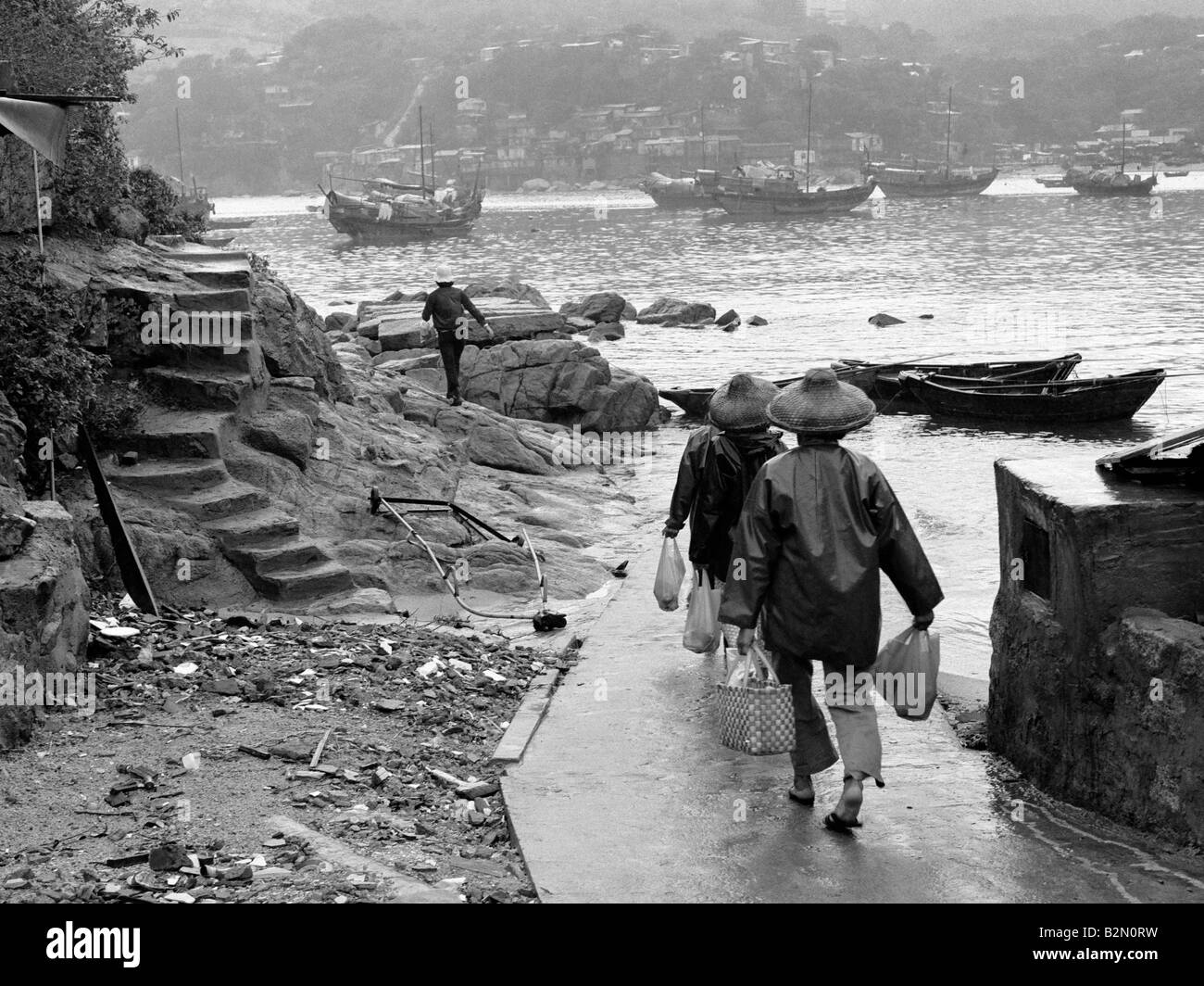 Tanka people returning to their junks in the rain Stanley Village Hong ...