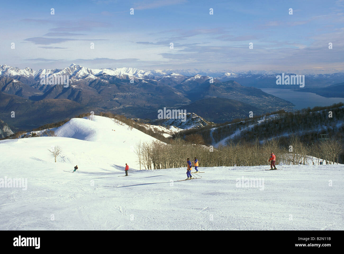 ski slopes and skiers, mottarone, italy Stock Photo - Alamy
