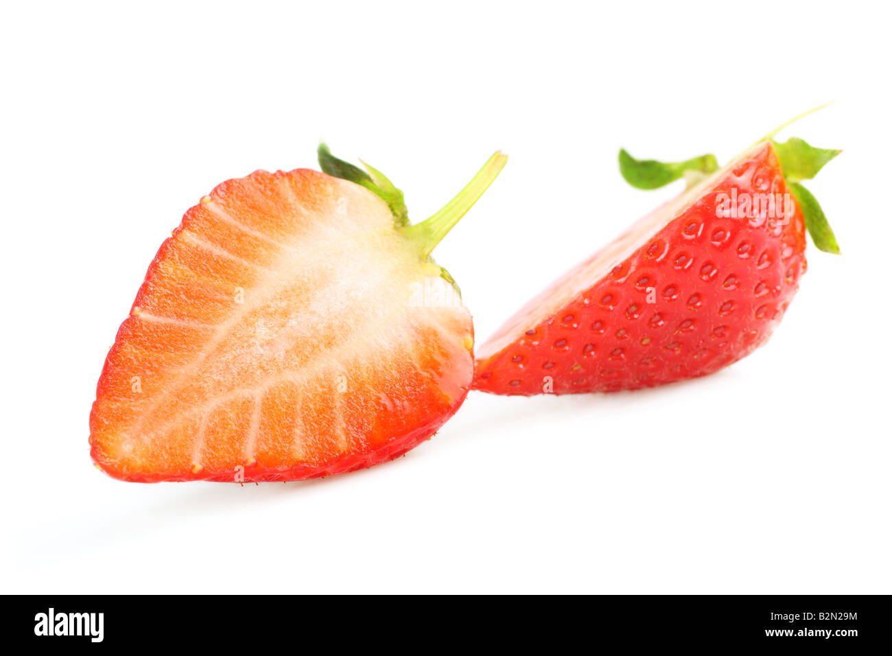 freshly halved strawberry isolated on white background Stock Photo - Alamy