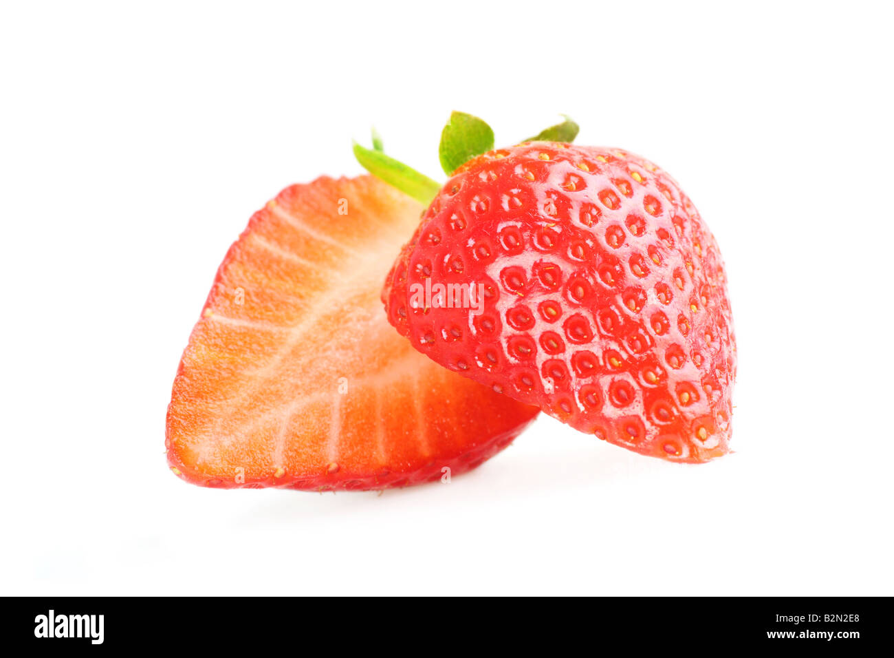 freshly halved strawberry isolated on white background Stock Photo - Alamy