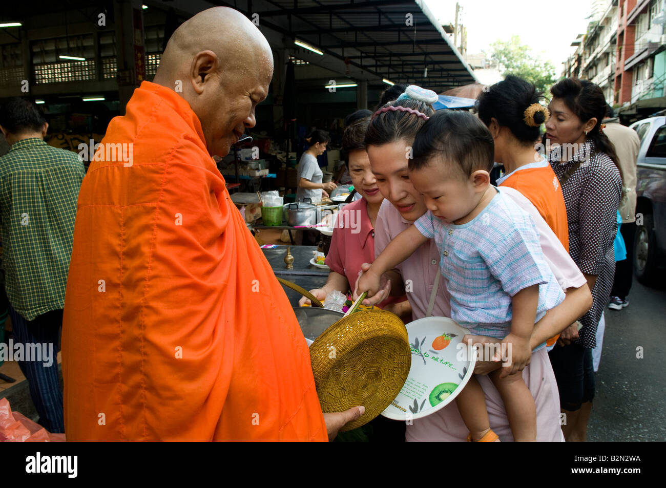 Buddhist monks blessing the people Stock Photo - Alamy