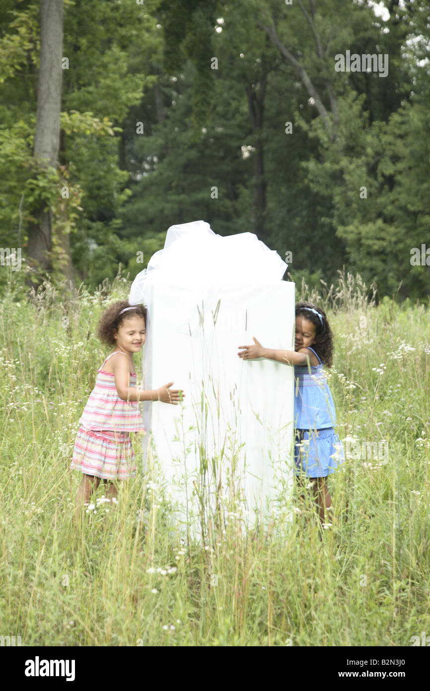 two children with large present Stock Photo - Alamy