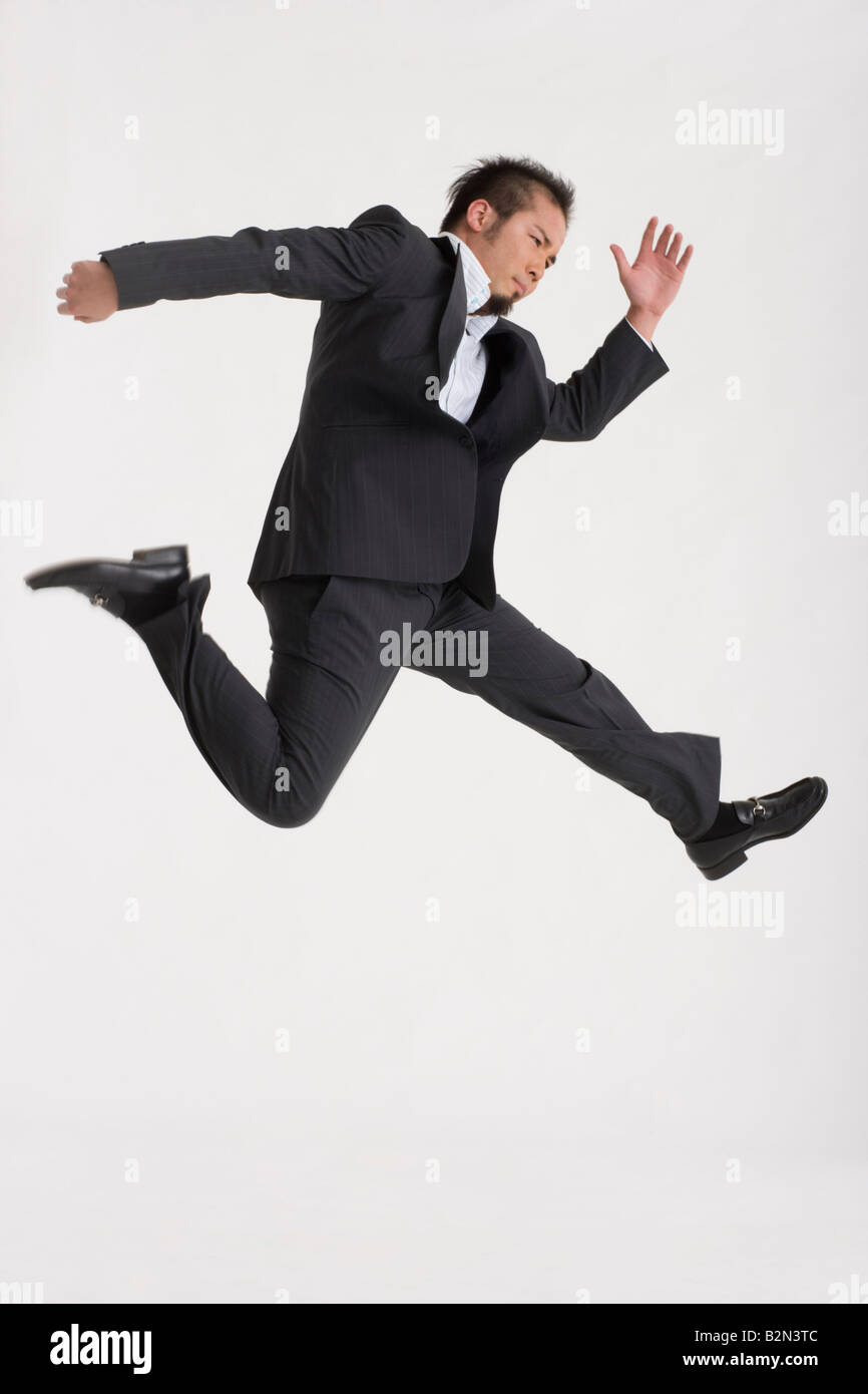 Side profile of a businessman running Stock Photo - Alamy