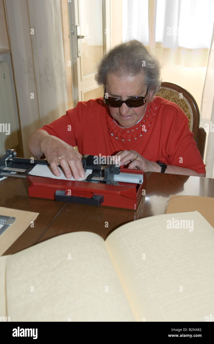 blind woman and braille typewriter, nembro, Italy Stock Photo - Alamy