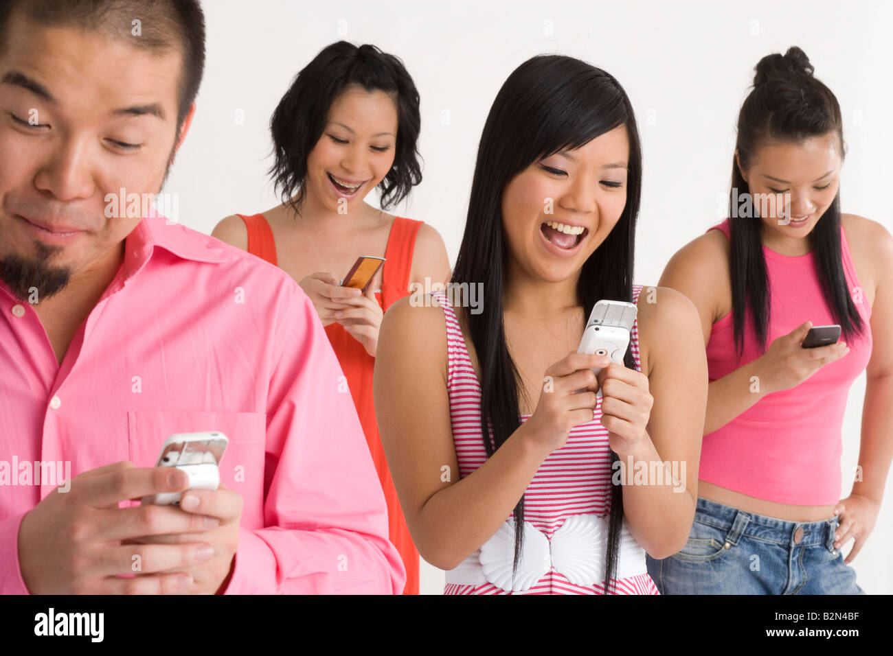 Four chinese friends using hi-res stock photography and images - Alamy