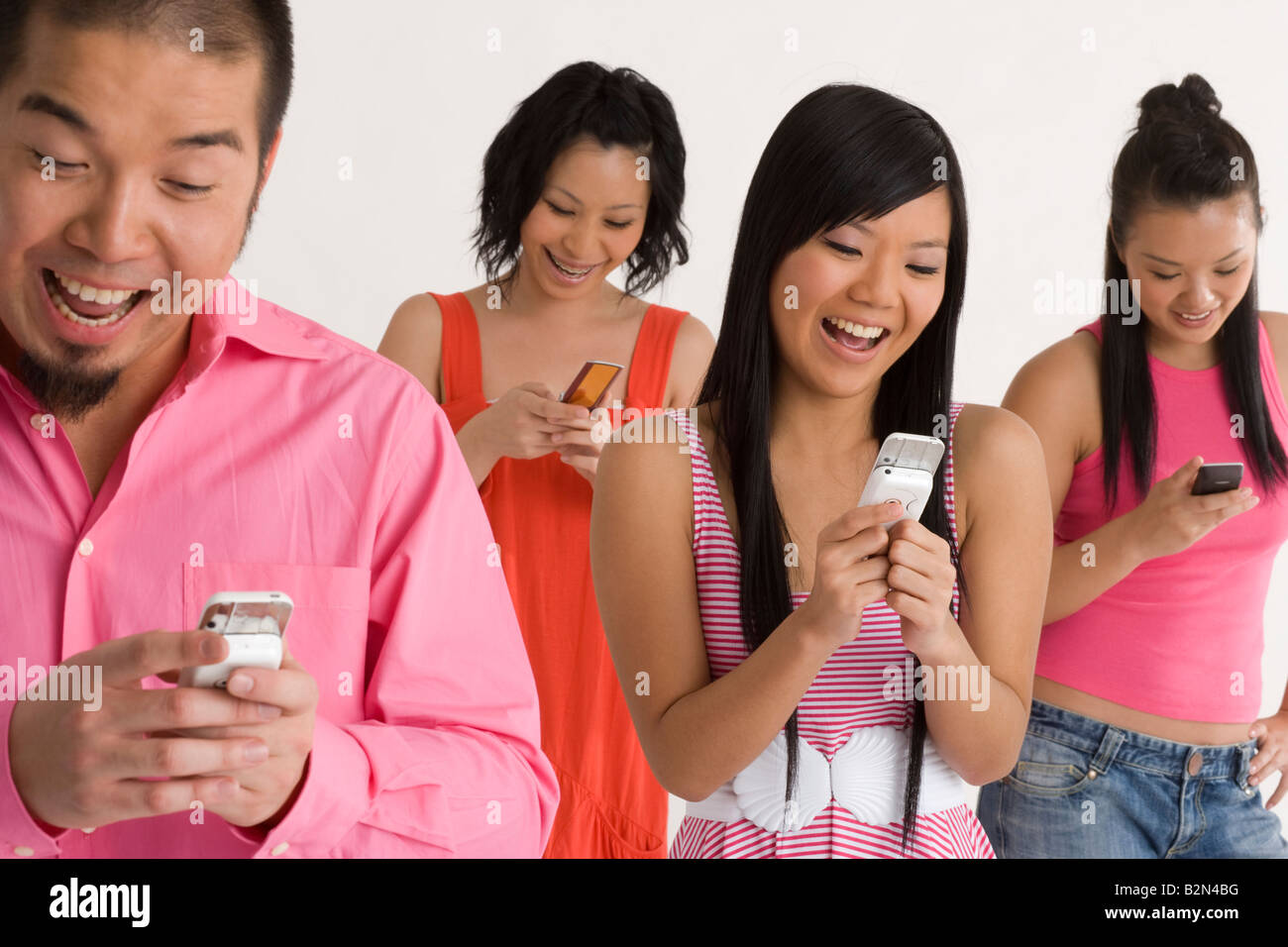 Four chinese friends using hi-res stock photography and images - Alamy