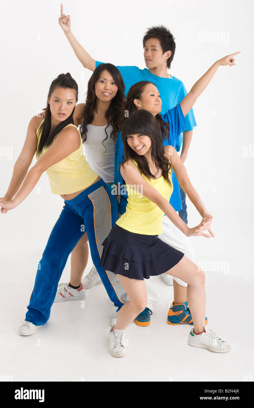 Young man dancing with four young women Stock Photo - Alamy