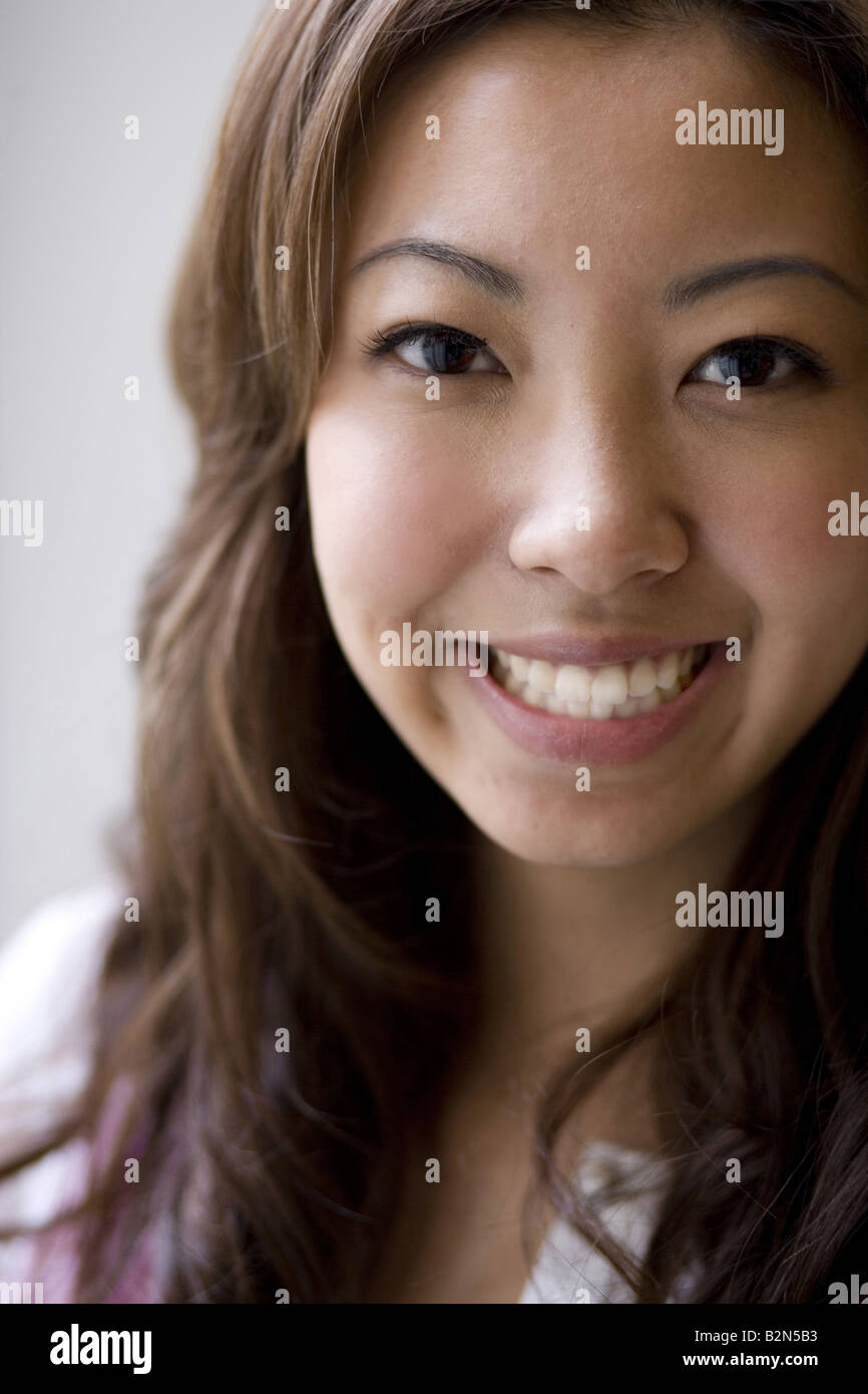 Portrait of a cheerful young woman Stock Photo - Alamy