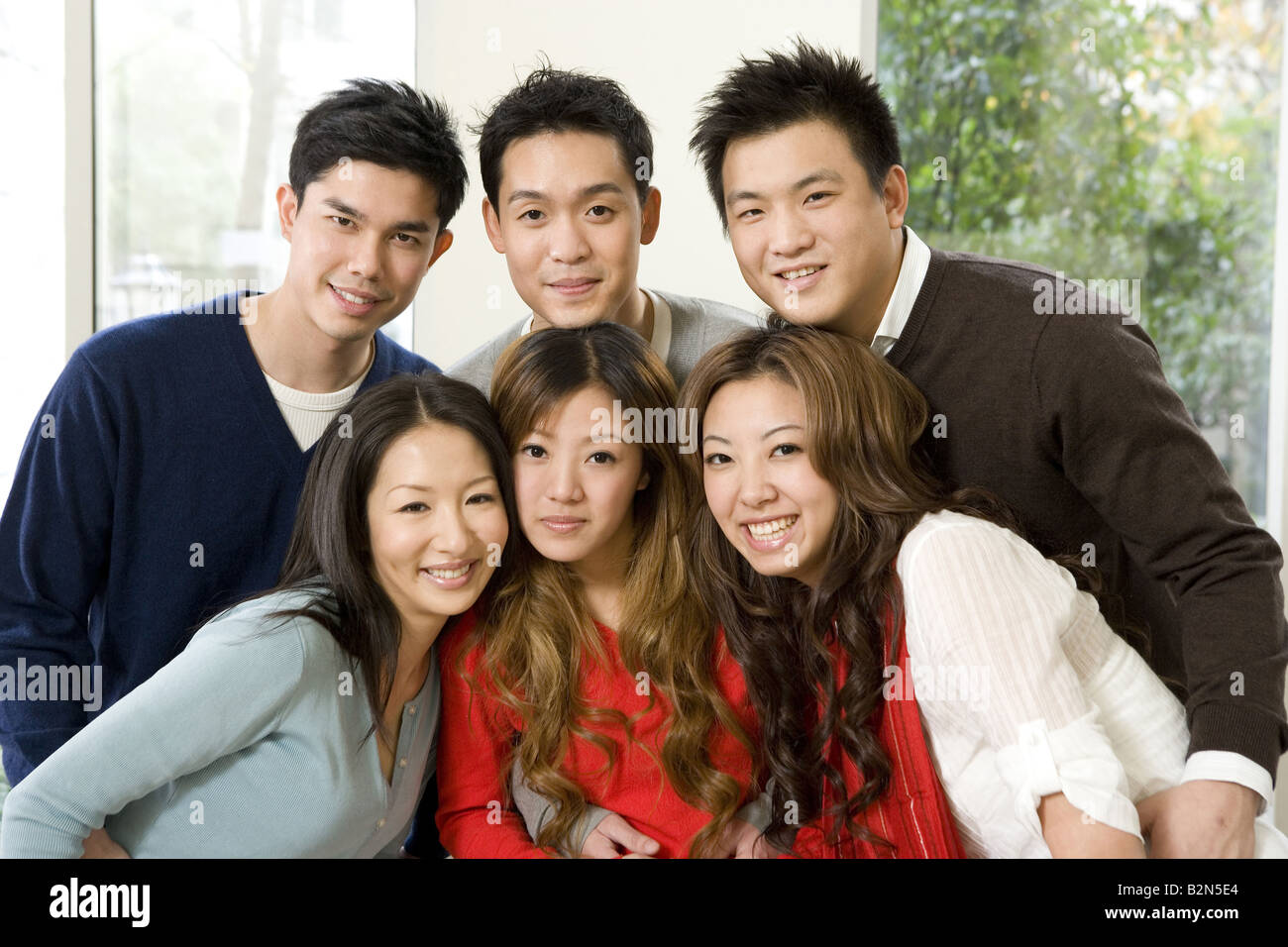 Portrait of friends smiling Stock Photo - Alamy