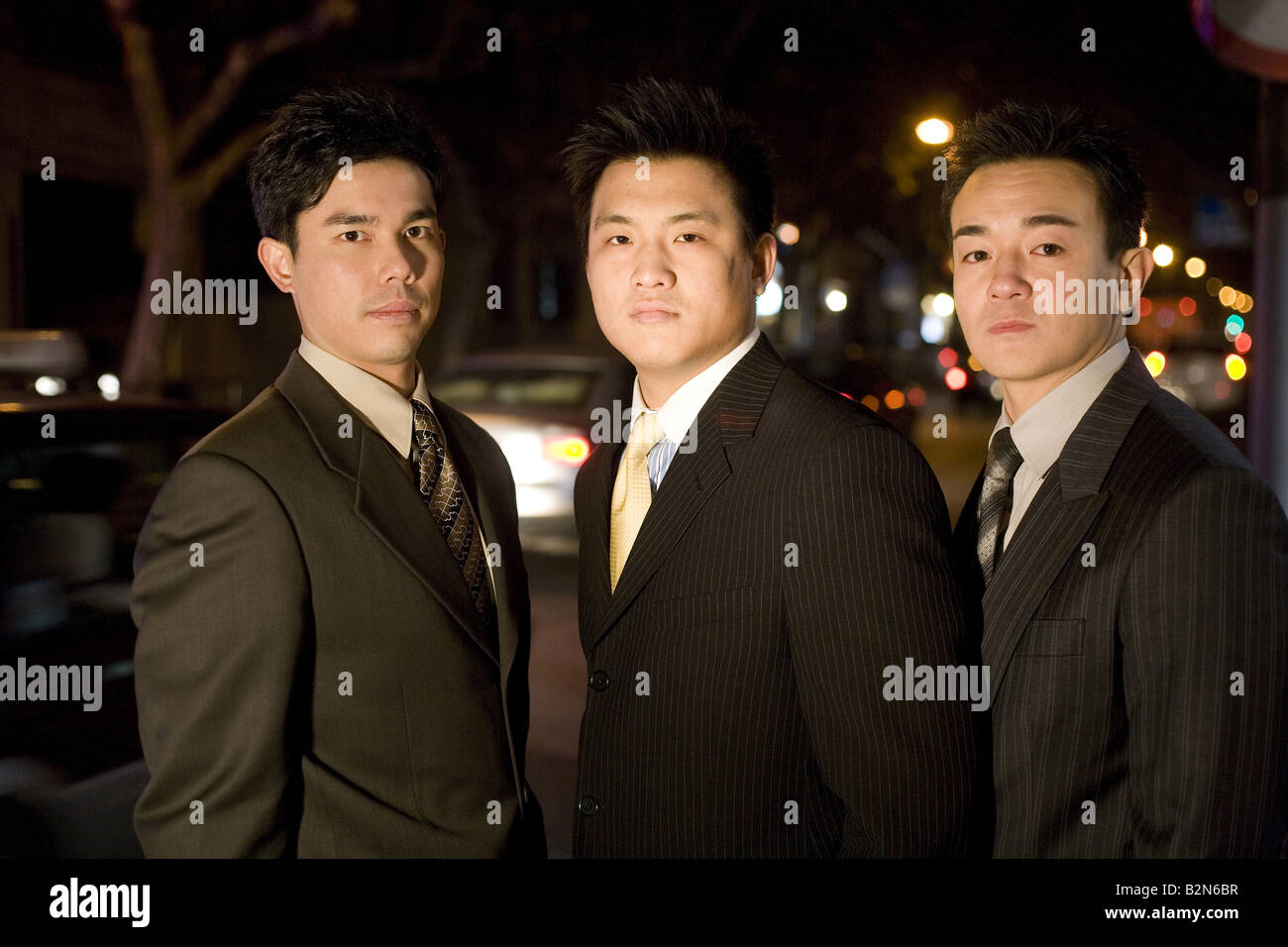 Portrait of businessmen standing in a row Stock Photo - Alamy