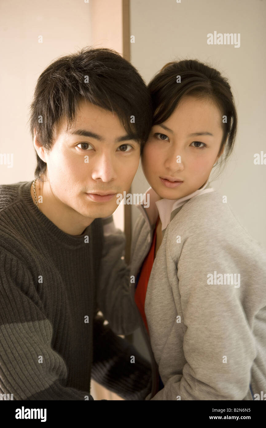 Portrait of a mid adult man and a young woman romancing, Shanghai ...