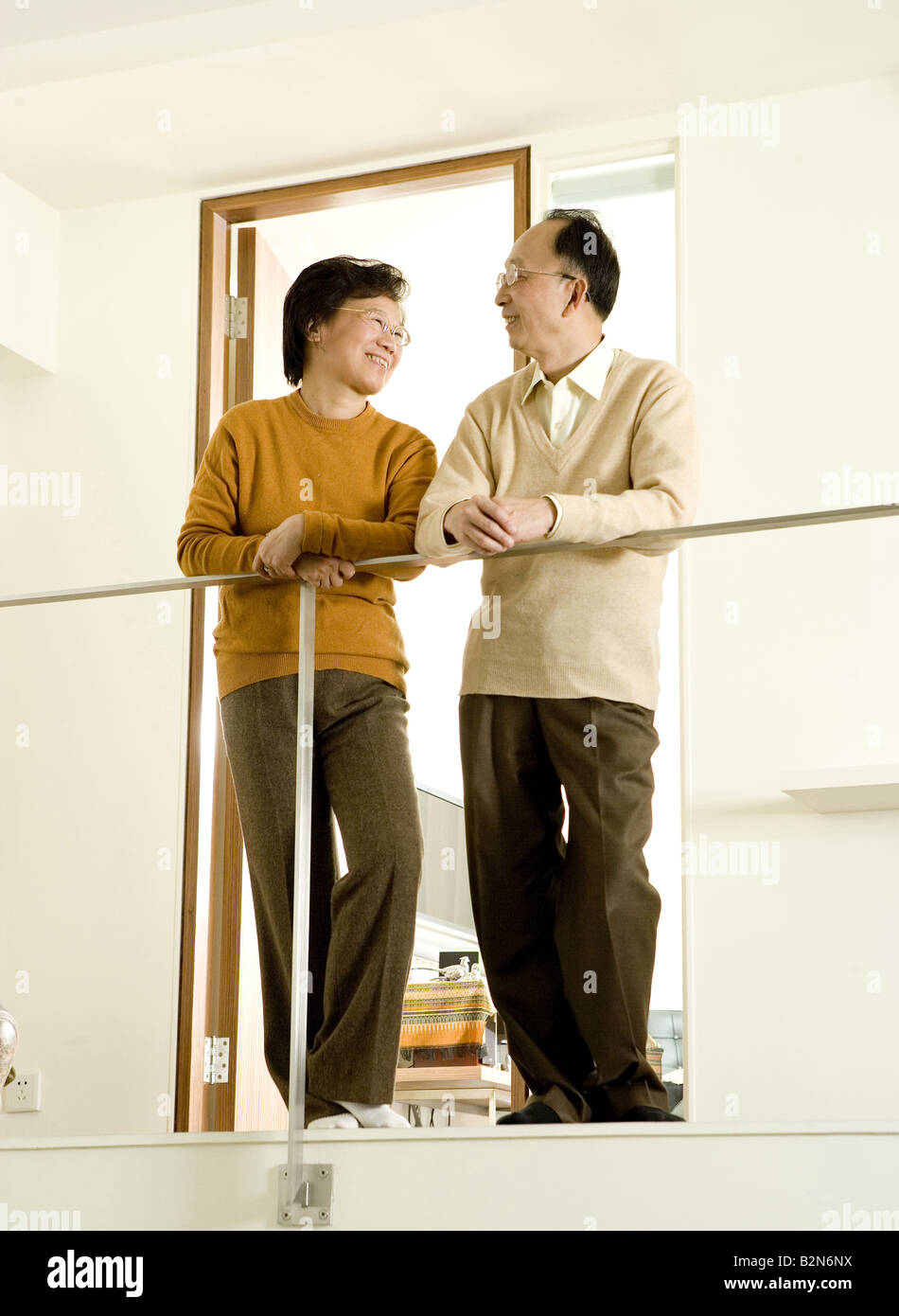 Senior couple looking over railing hi-res stock photography and images ...