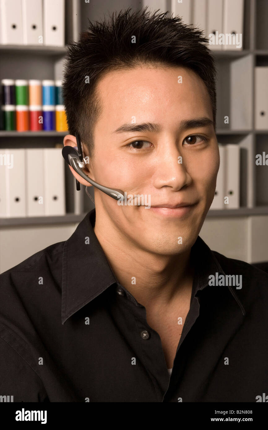 Portrait of a male customer service representative smiling Stock Photo ...