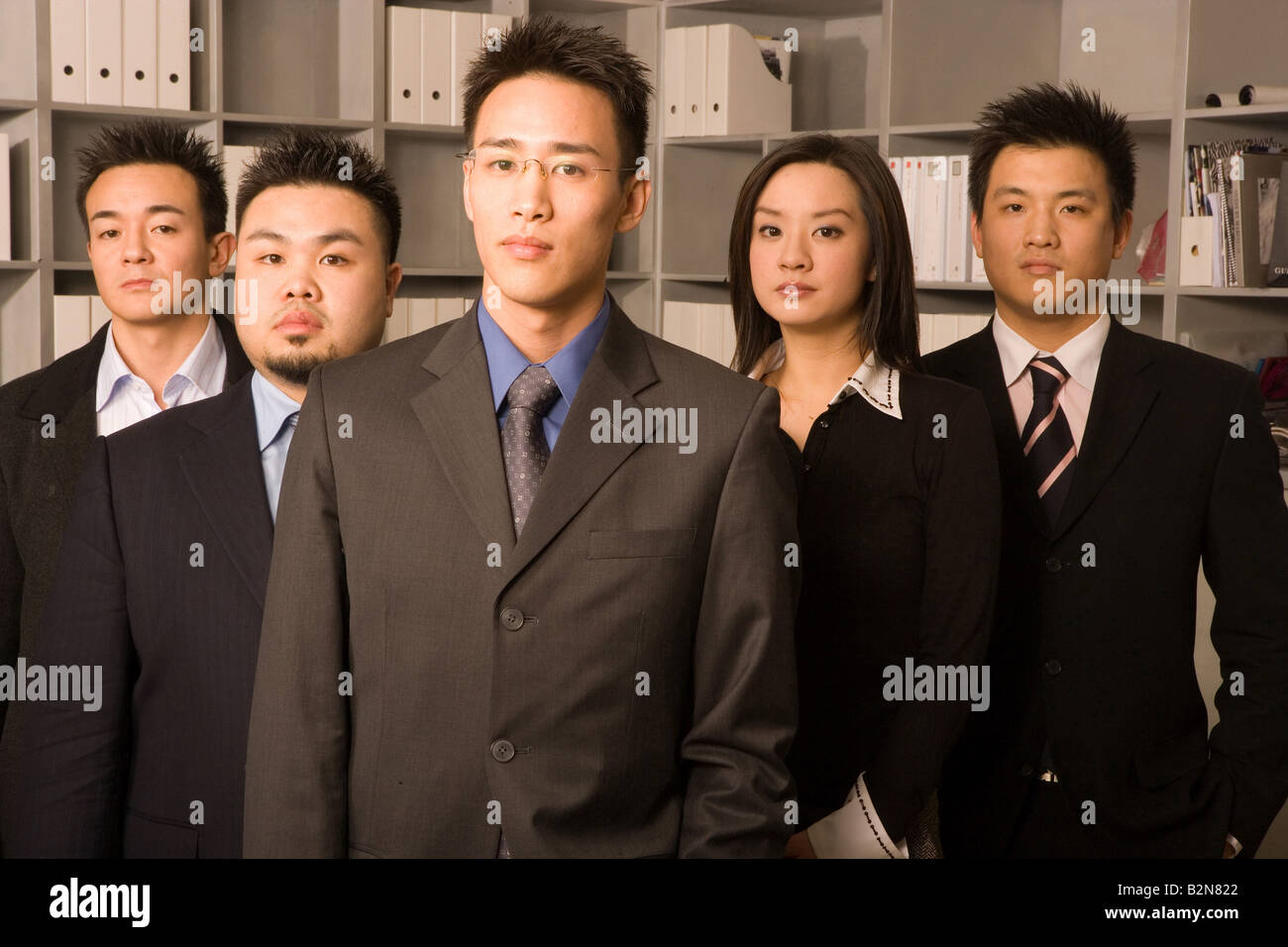 Portrait of five business executives standing together Stock Photo - Alamy