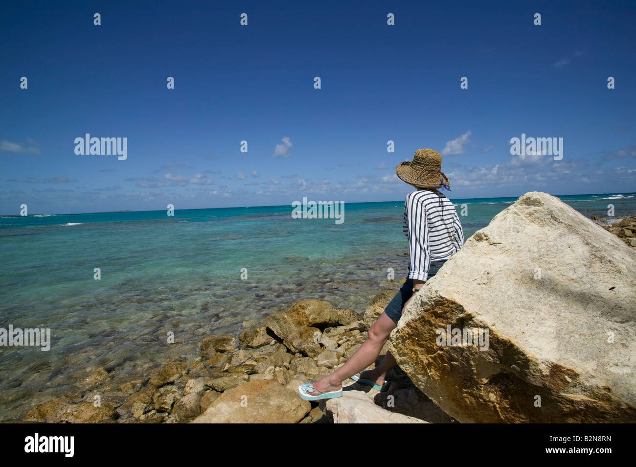 A woman looking out to sea Stock Photo - Alamy