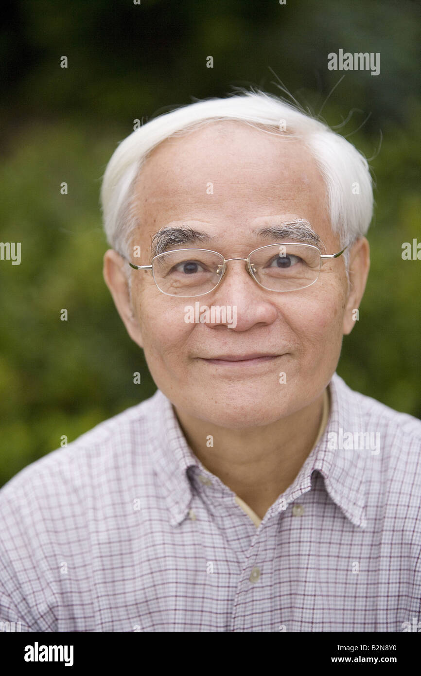 Portrait of a senior man smirking Stock Photo - Alamy
