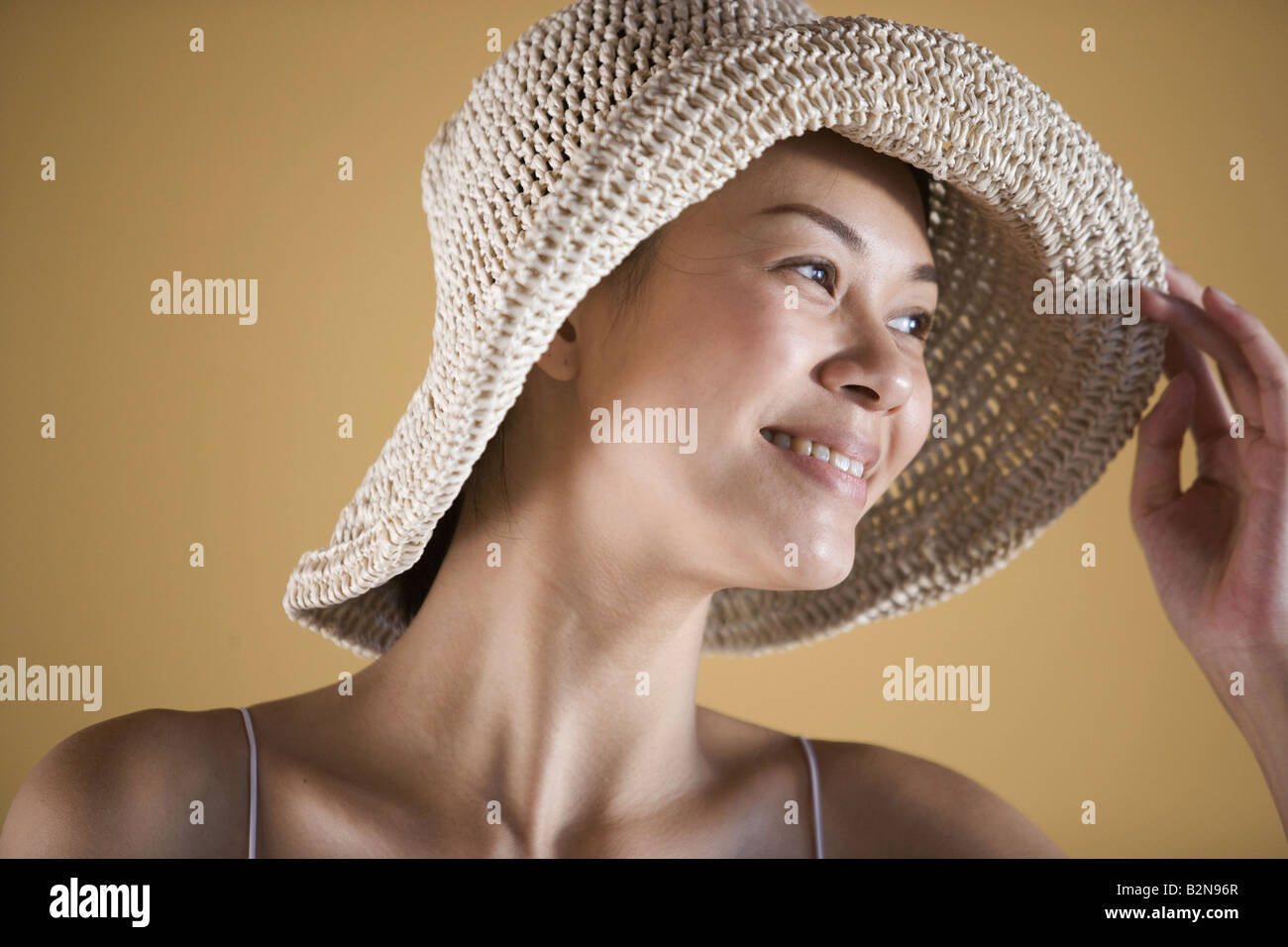 Happy asian woman wearing a sun hat hi-res stock photography and images ...