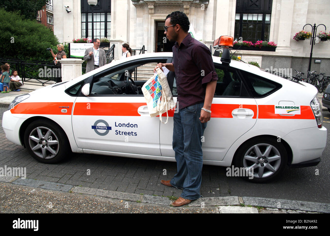 Toyota Prius hybrid car in London Streets livery Stock Photo - Alamy