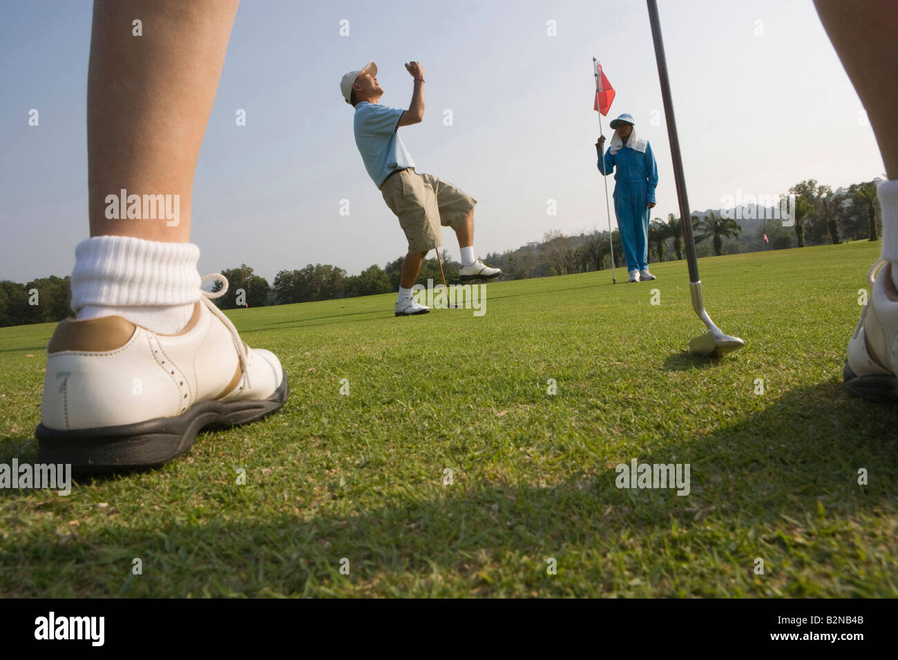 Three golf players in hi-res stock photography and images - Alamy