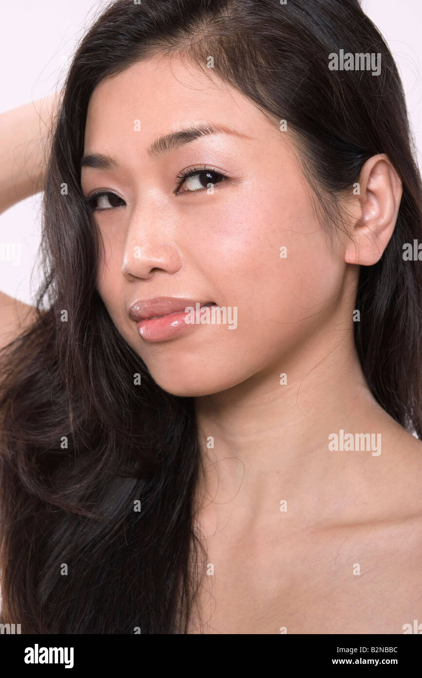 A beautiful woman smirking hi-res stock photography and images - Alamy