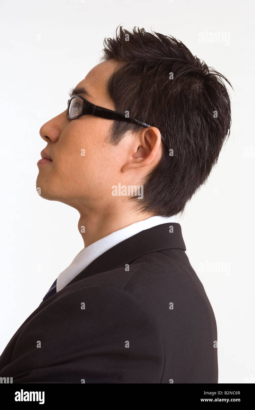Side profile of a businessman wearing eyeglasses Stock Photo - Alamy
