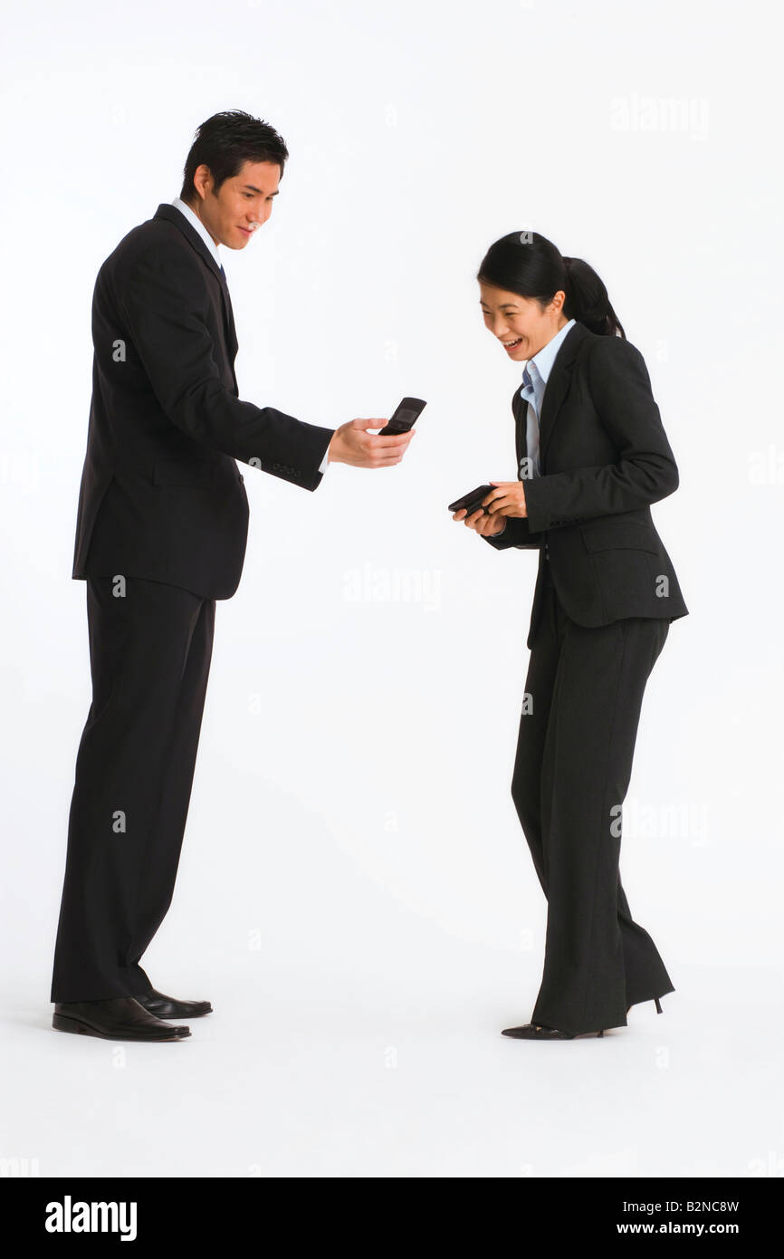 Two people showing phone Cut Out Stock Images & Pictures - Alamy