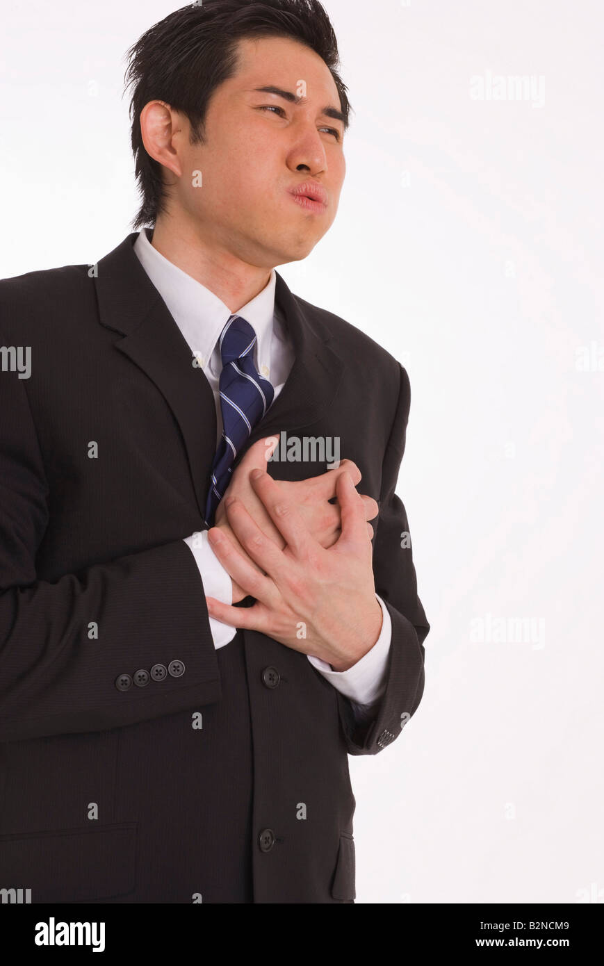 Close-up of a businessman suffering from chest pain Stock Photo - Alamy