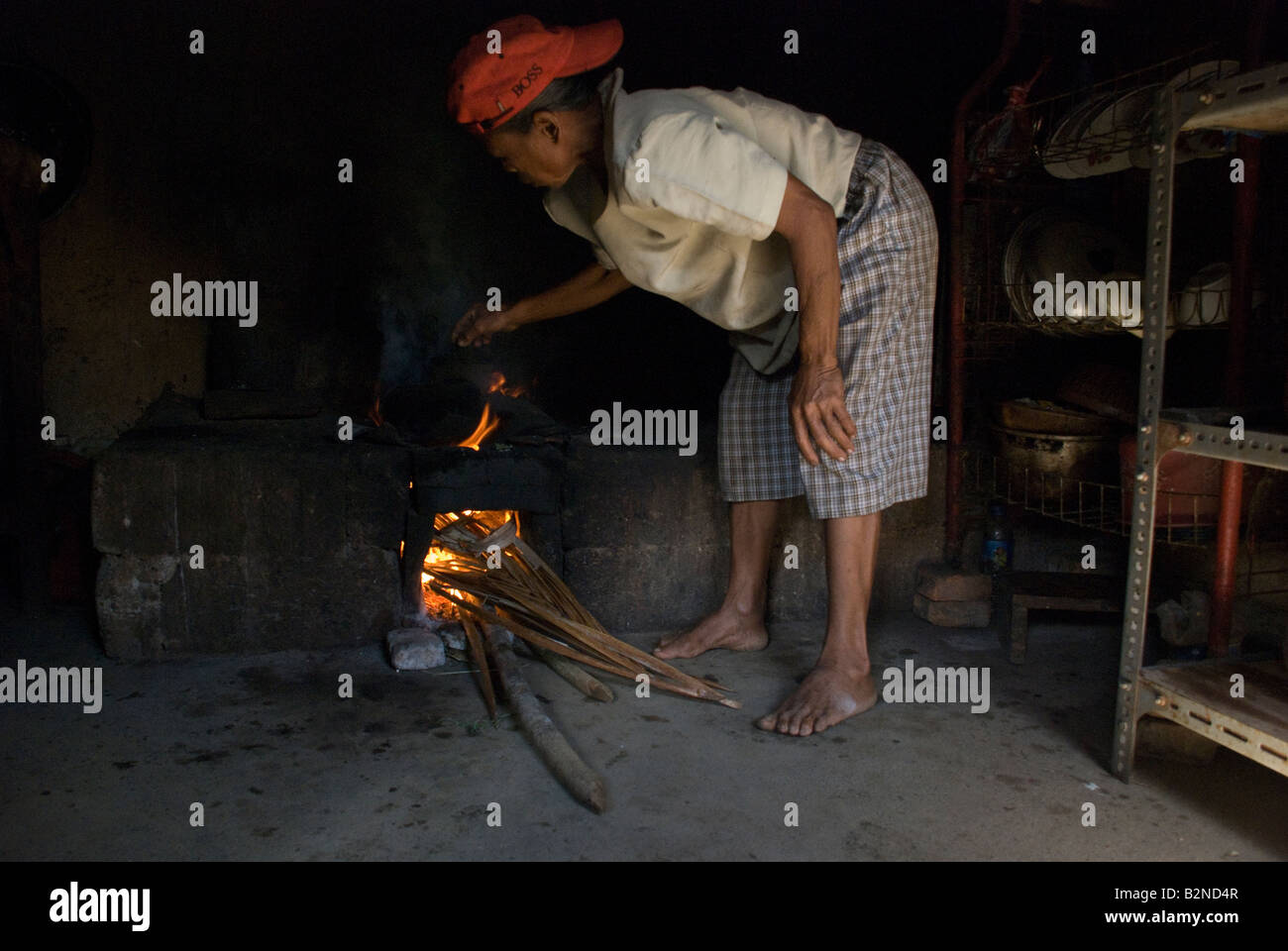 bali ubud indonesia lady home kitchen fire chimney elderly old cooking ...
