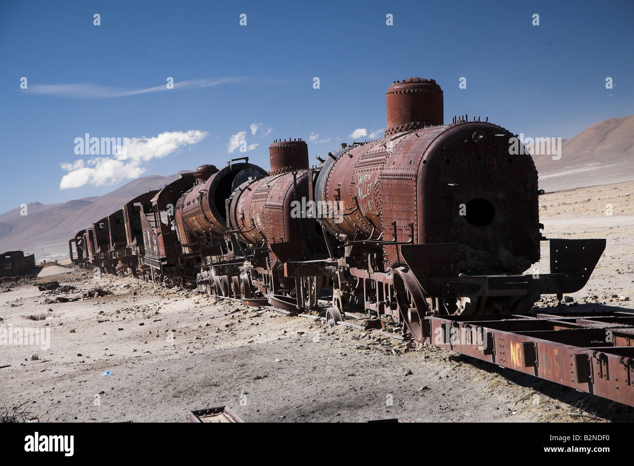 Train cemetery on the edge of Salar de Uyuni in Bolivia Stock Photo - Alamy