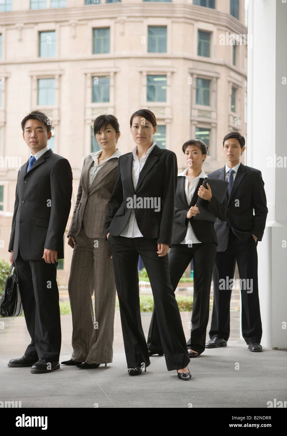 Portrait of five business executives standing together Stock Photo - Alamy