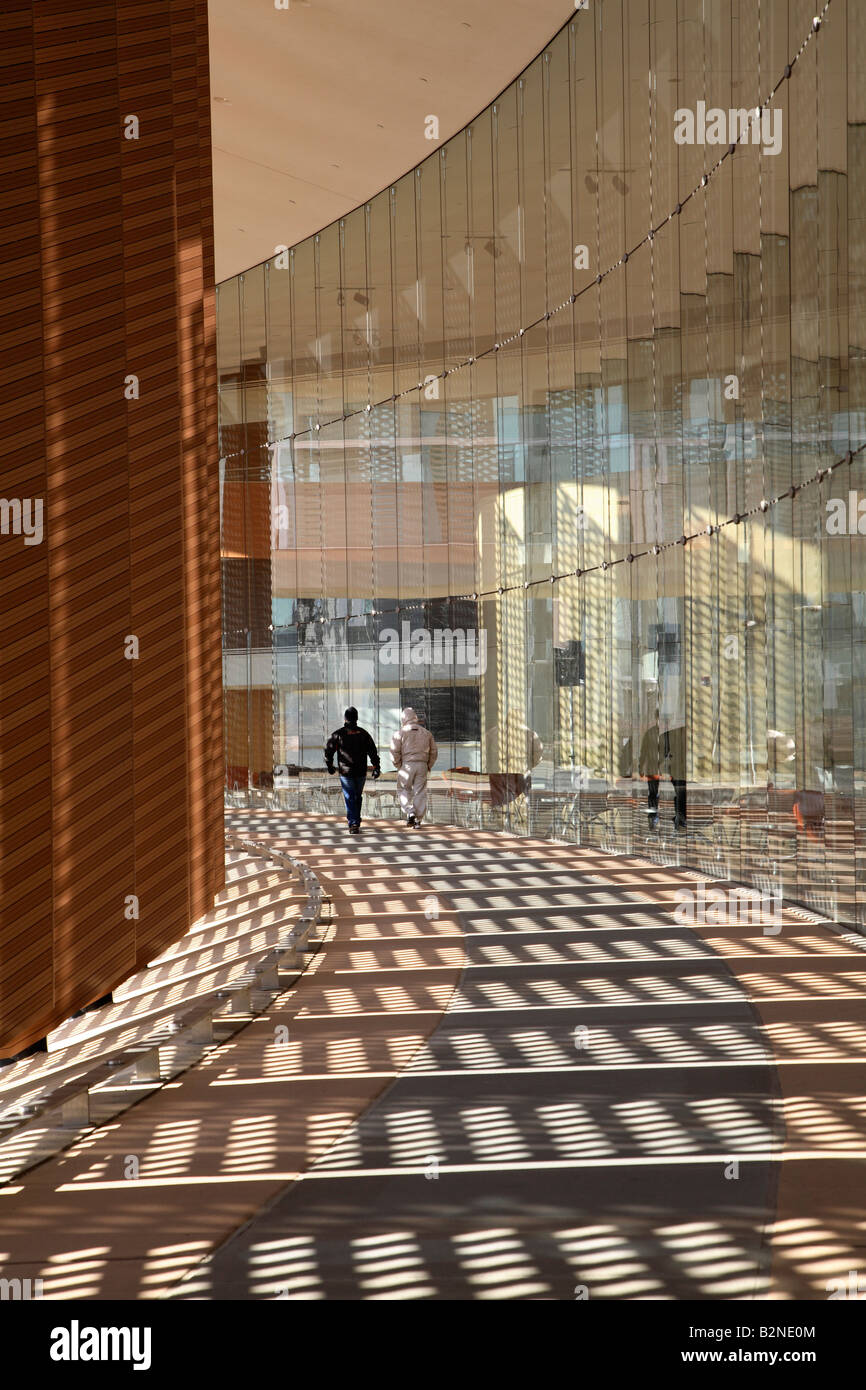 Two people walking away down walkway outside Carl Icahn Laboratory at ...