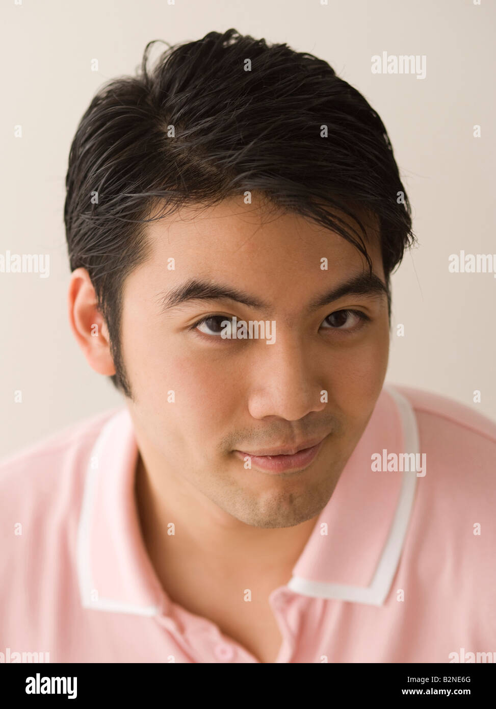 Portrait of a young man grinning Stock Photo - Alamy