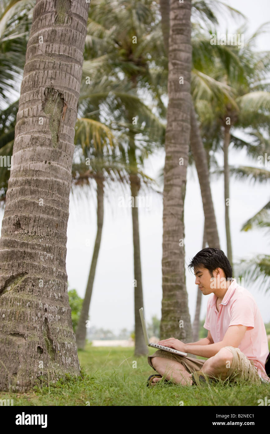 Side profile of a young man using a laptop Stock Photo - Alamy