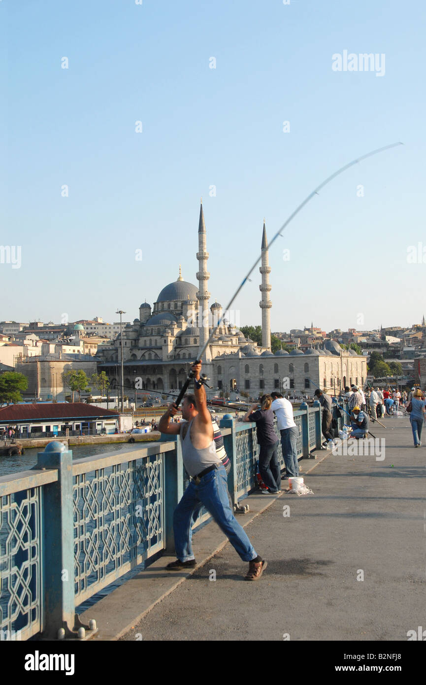 man casting with a fishing rod Stock Photo - Alamy