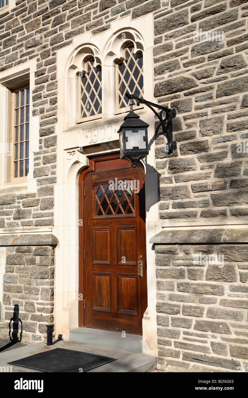 Close up of wooden door with two diamond shaped windows in top at ...