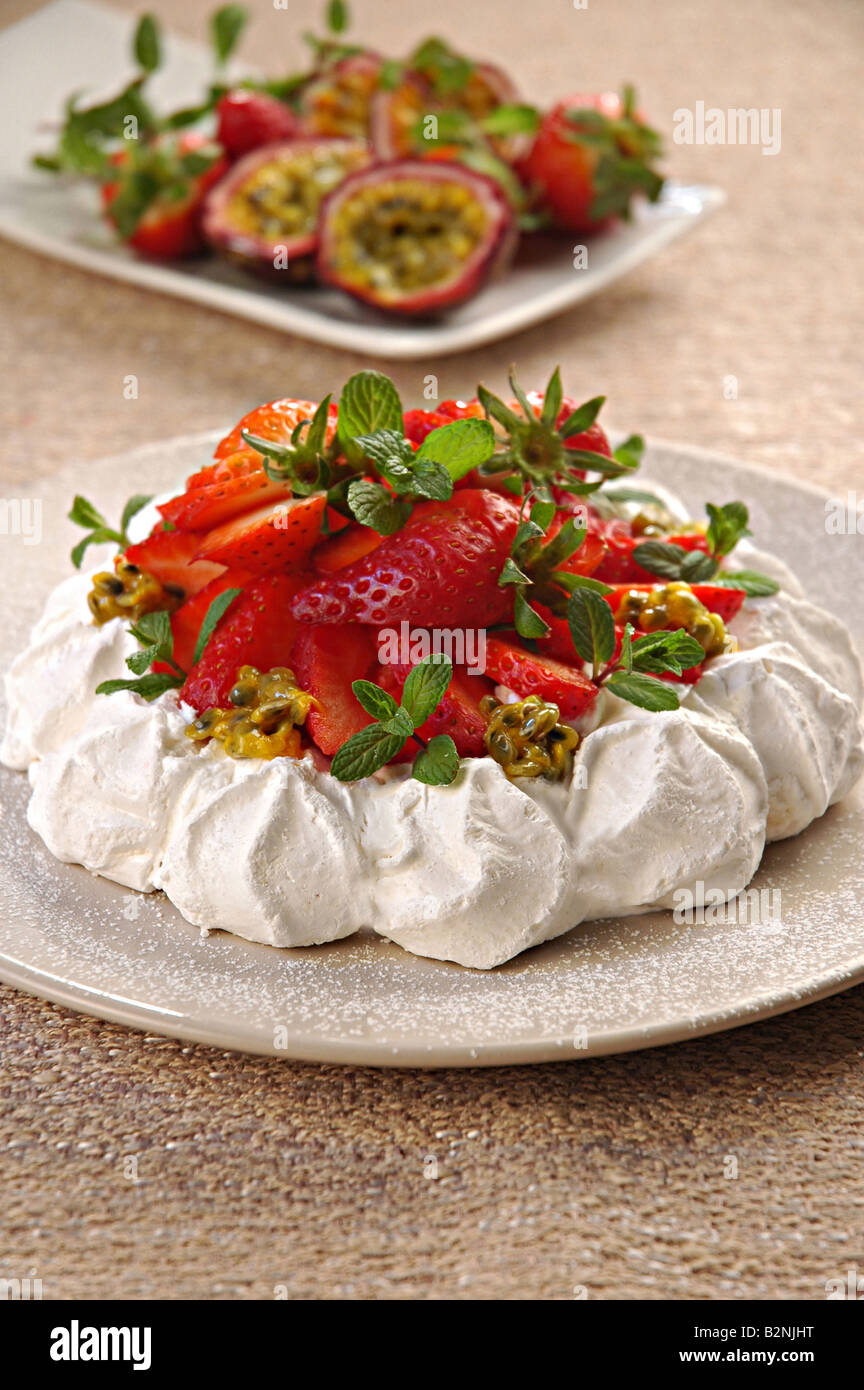 Pavlova meringue cake with cream and fruits hi-res stock photography ...