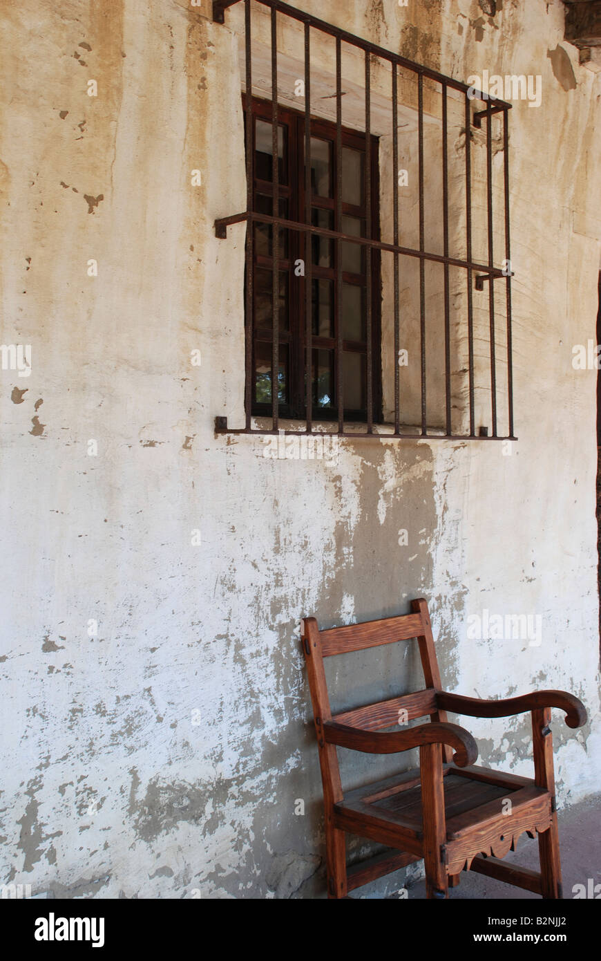 Wooden chair and Iron-barred window outside one of the monks rooms of ...