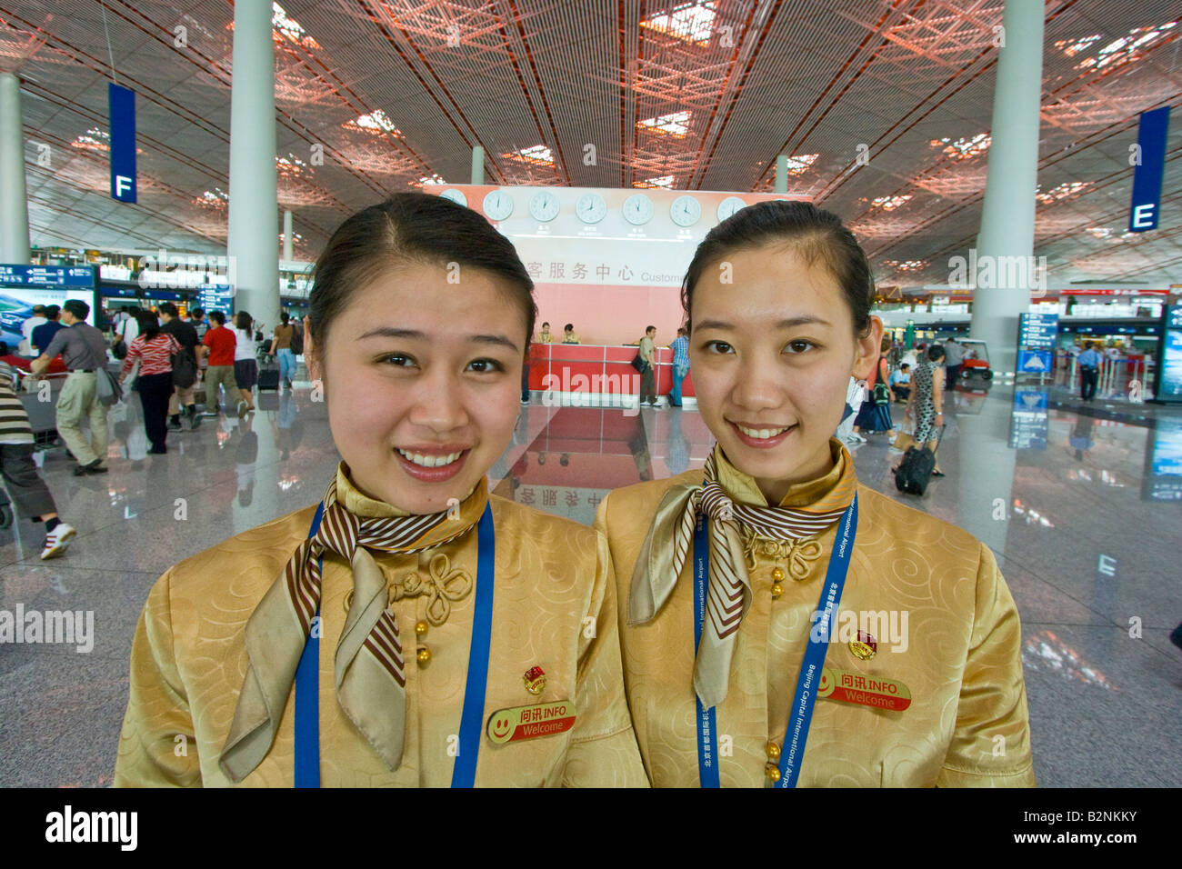 Two Young Airport Information Booth Employees at Beijing International ...