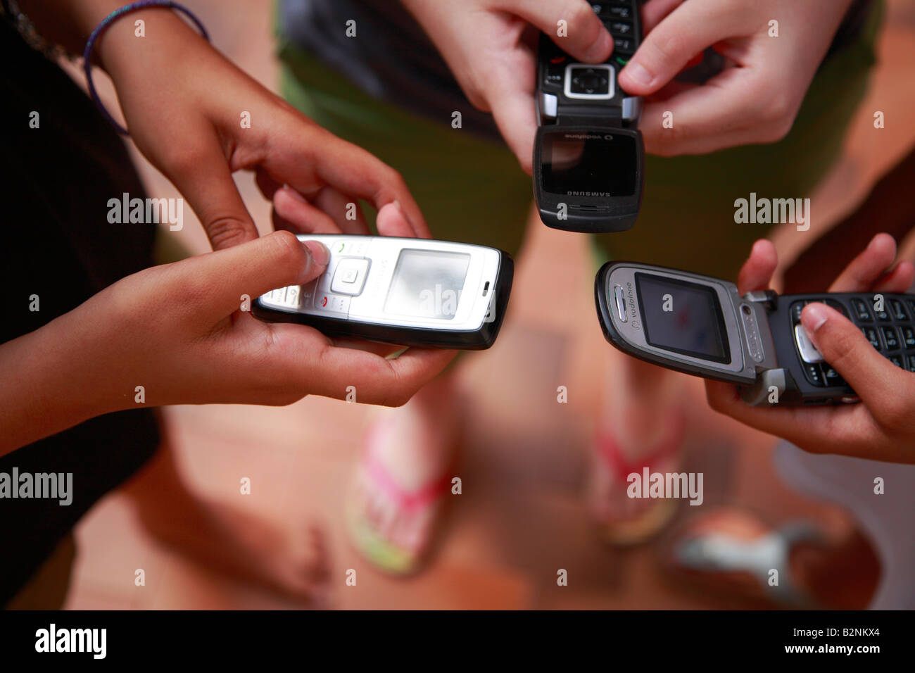 girls using cell mobile phones Stock Photo - Alamy