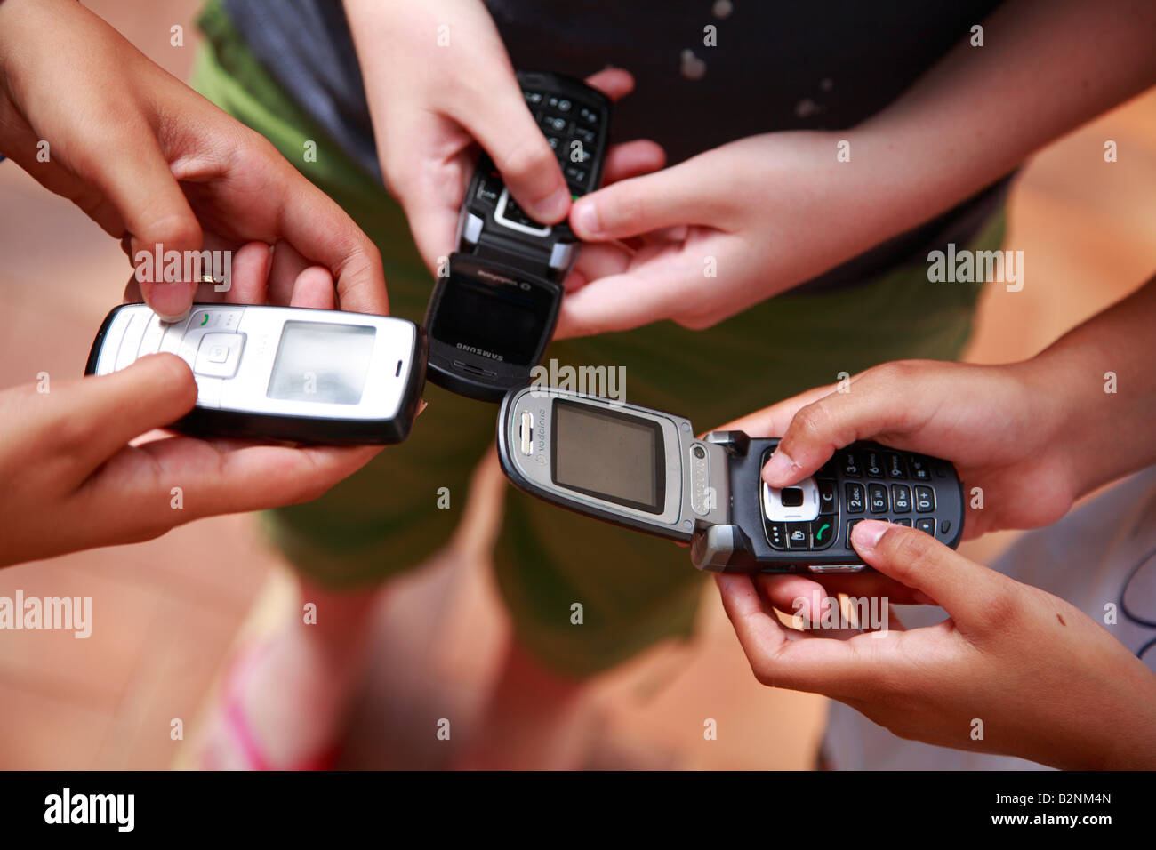 girls using cell mobile phones Stock Photo - Alamy