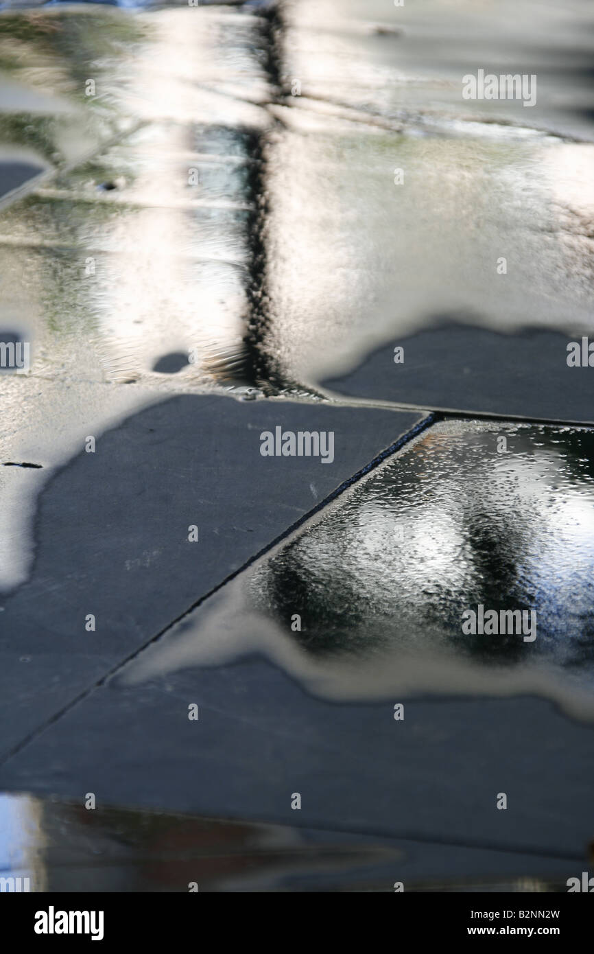 abstract wet pavement tiles in rain in morning sun Stock Photo - Alamy