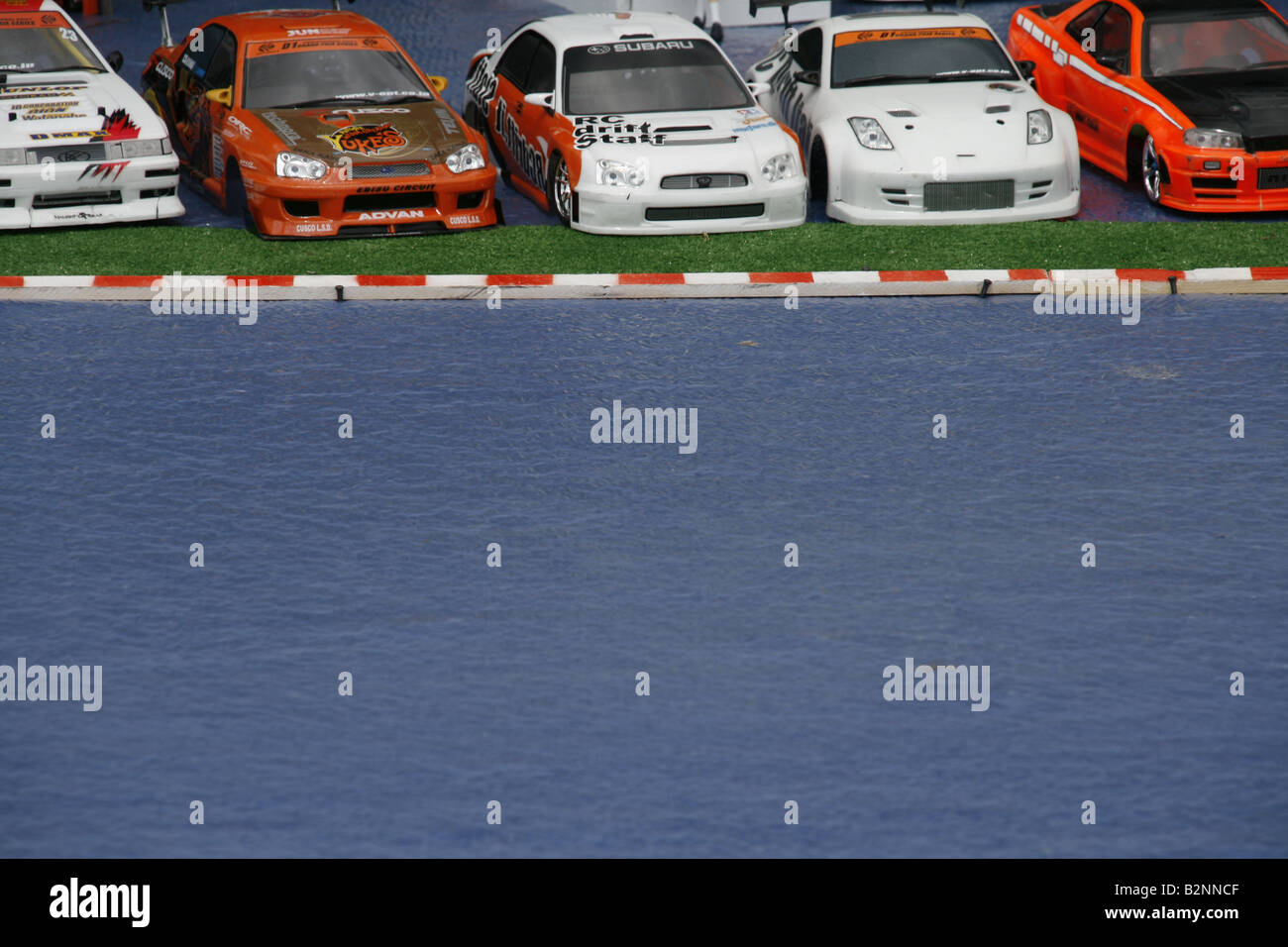 miniature toy rally cars by race track Stock Photo - Alamy