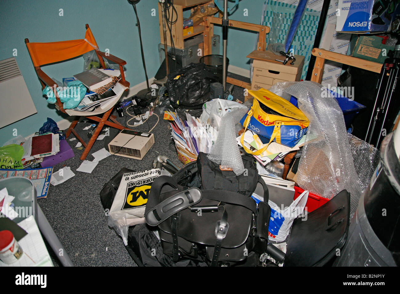 Untidy and cluttered office area strewn with rubbish Stock Photo - Alamy